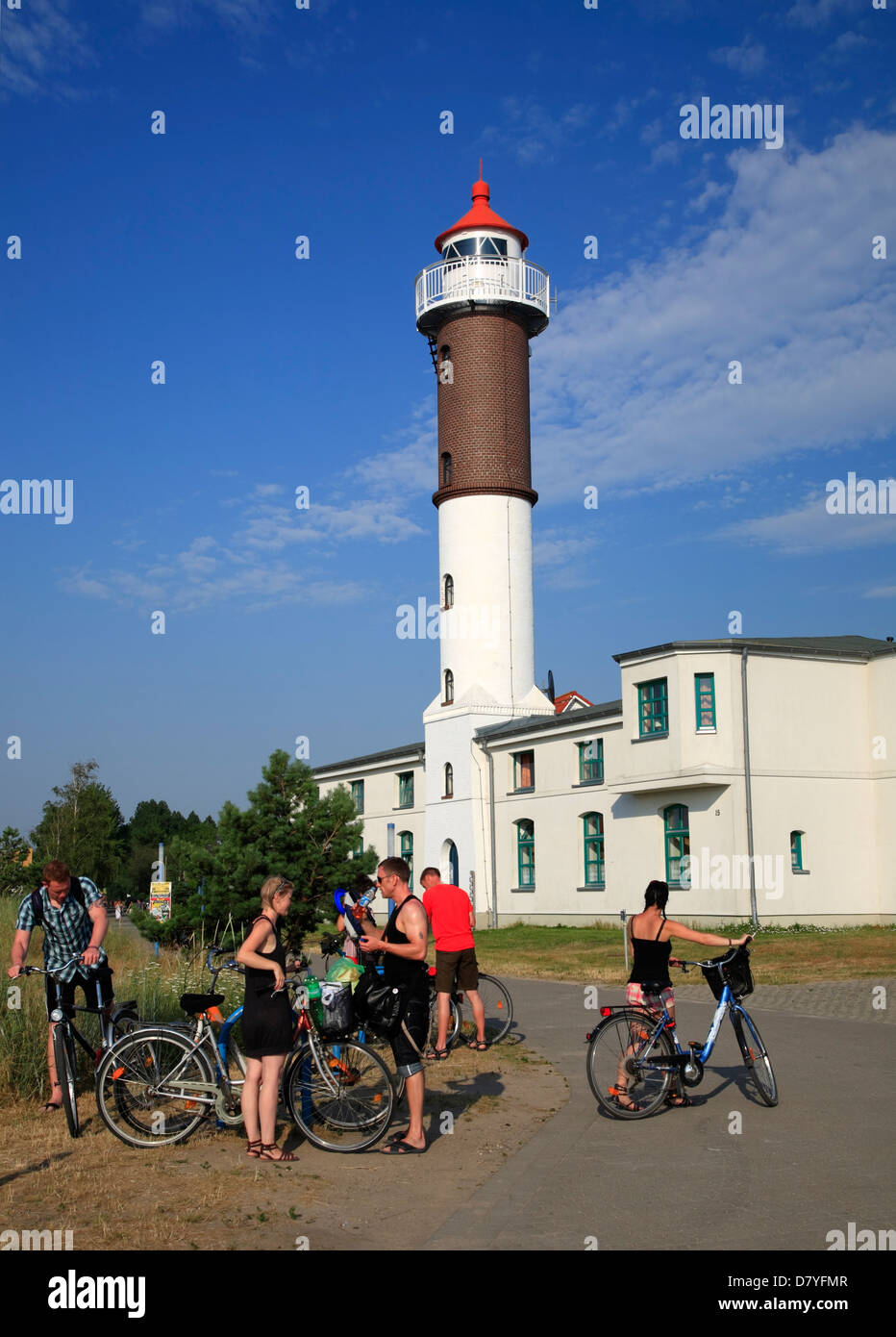 Cyclists at lighthouse Timmendorf, Poel Island, Mecklenburg, Germany ...