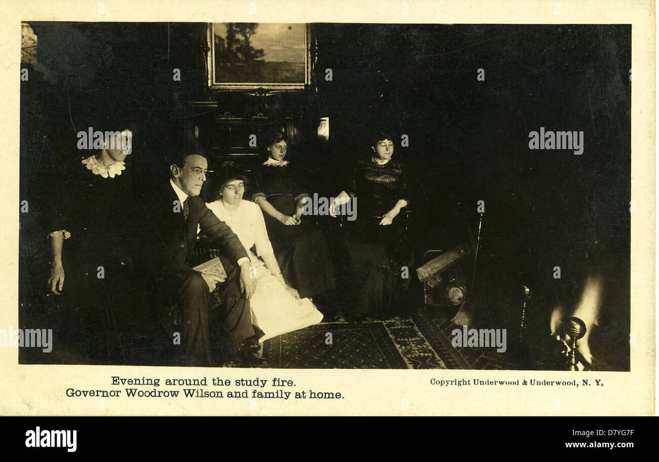 This image captures the Wilson family gathered around a study fire. It ...