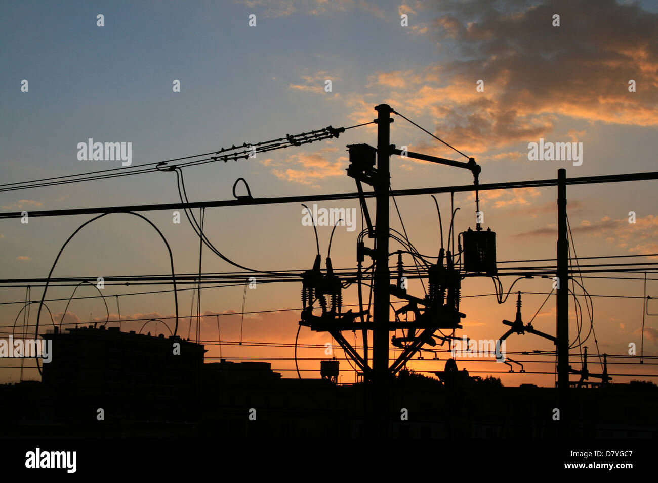 overhead train power lines in rome italy at sunset Stock Photo - Alamy
