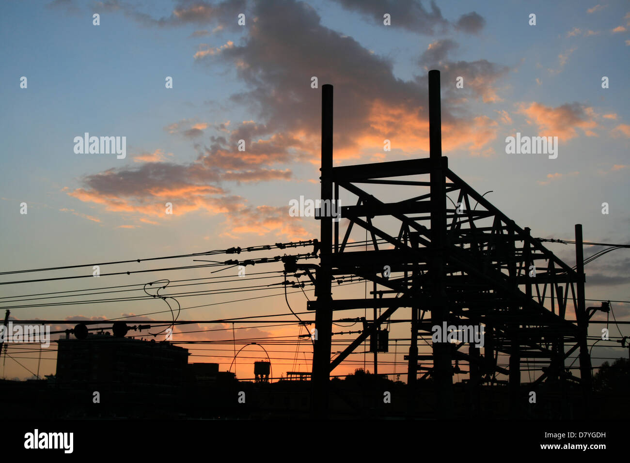 overhead train power lines in rome italy at sunset Stock Photo - Alamy