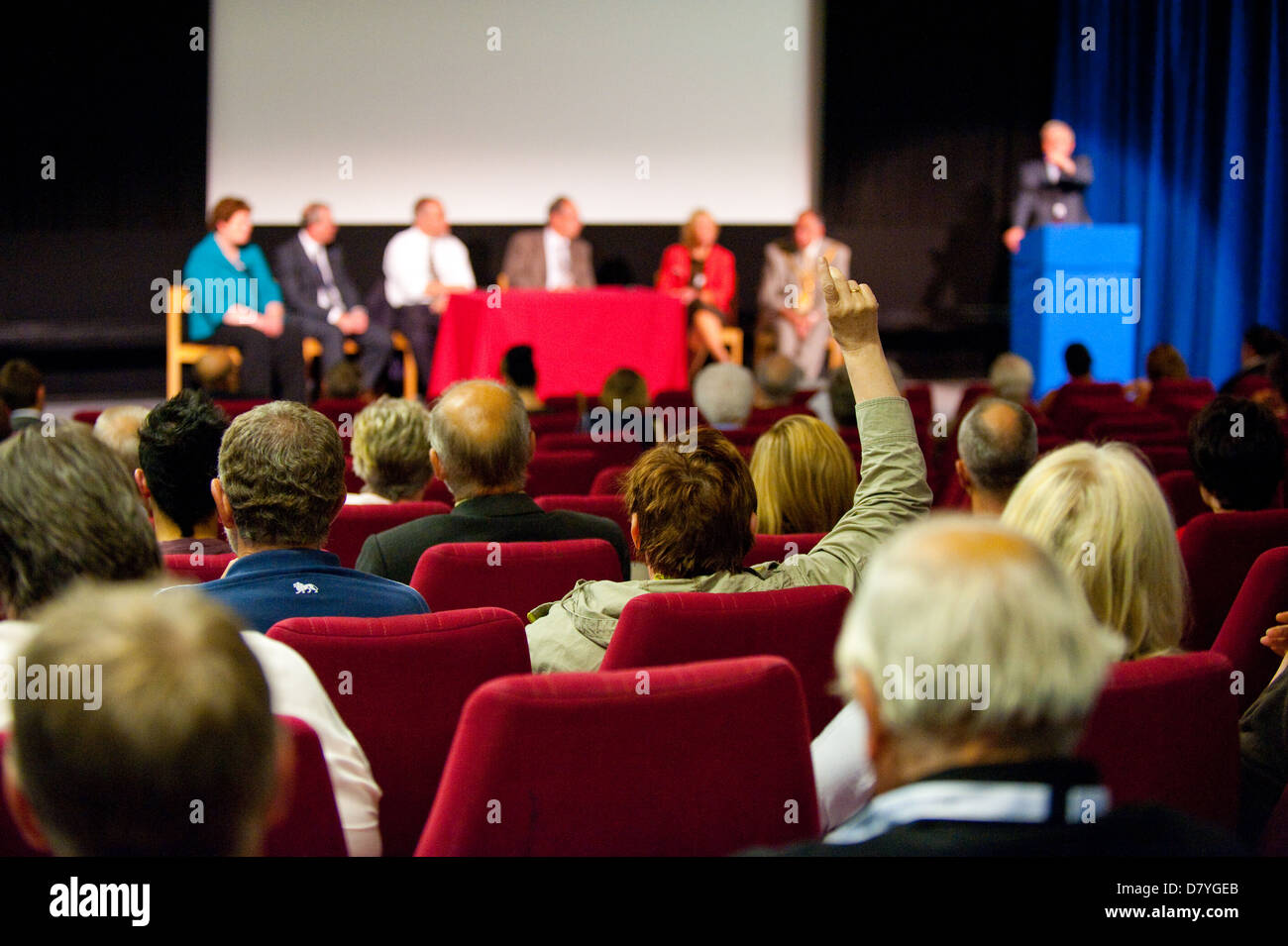 Raised hand at a meeting Stock Photo - Alamy