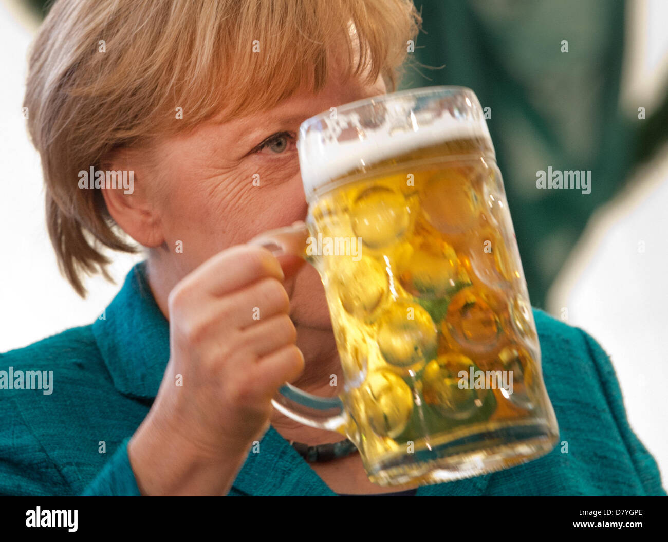 Munich, Germany. 15th May, 2013. German Chancellor Angela Merkel drinks ...