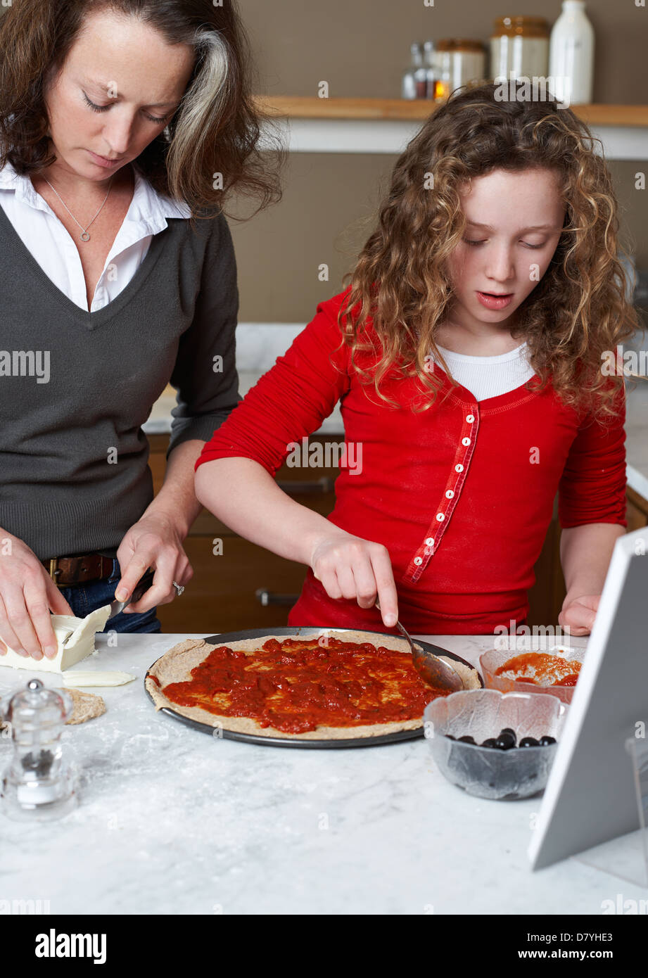 Mother and daughter cooking in kitchen Stock Photo - Alamy