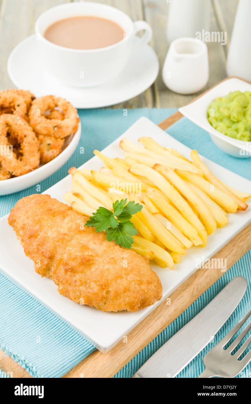 Fish & Chips - Battered cod fillet, chips and mushy peas Stock Photo ...