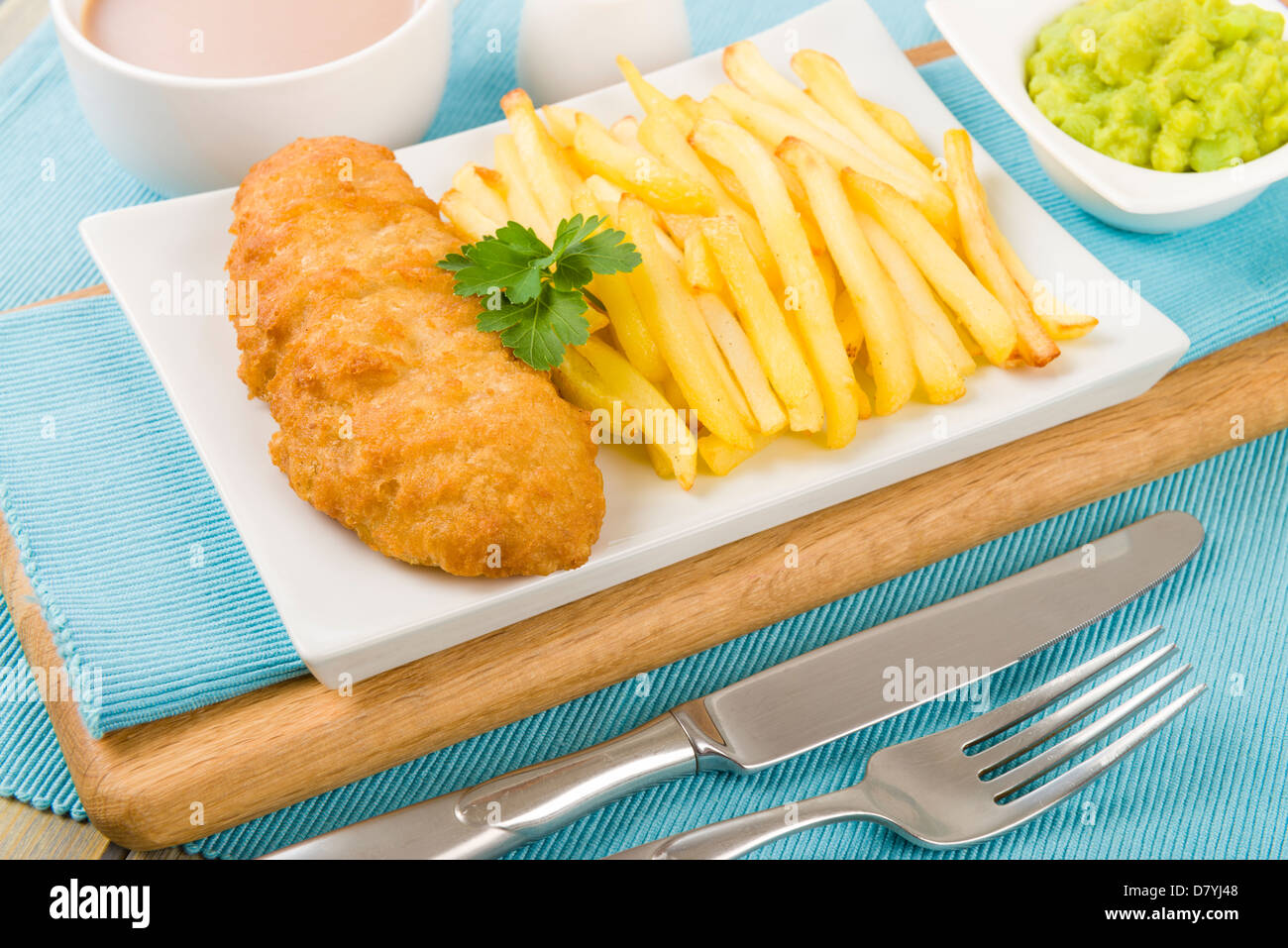 Fish & Chips - Battered cod fillet, chips and mushy peas Stock Photo ...