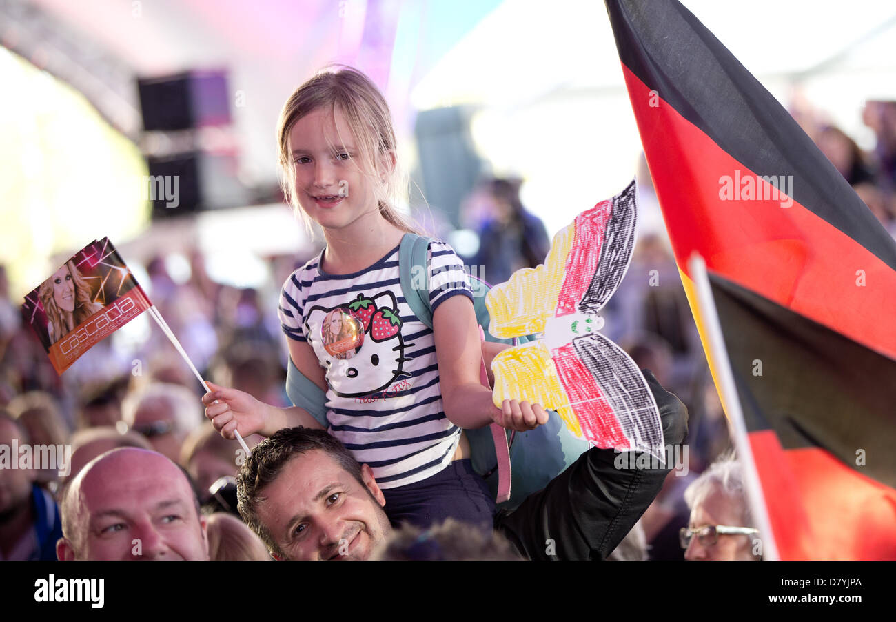 A girl cheers for the band Cascada representing Germany during the Big ...