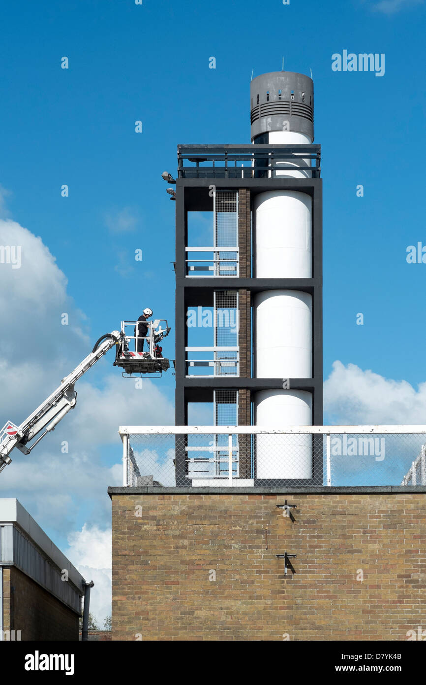 Fireman training on hydraulic lift platform and purpose built tower ...