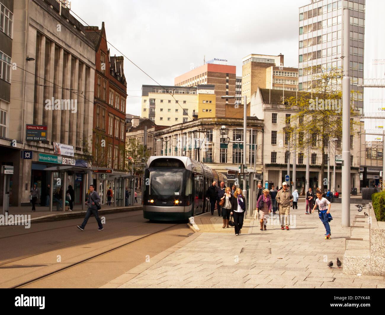 Tram line stop letting off passengers in Nottingham City Centre ...