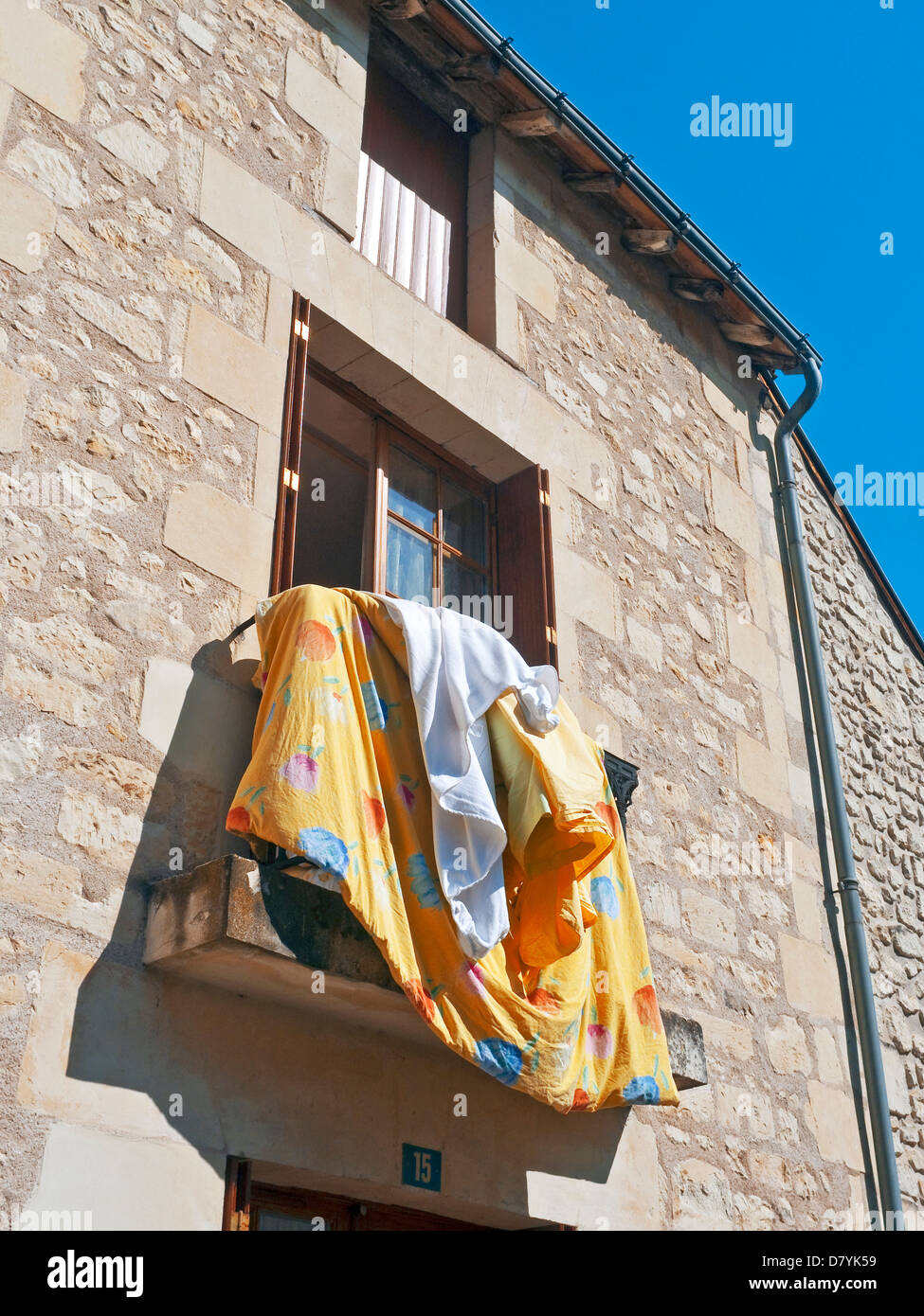 Bedding being aired from open window - France Stock Photo - Alamy