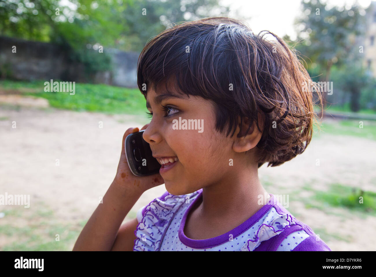 Indian girl talking on a mobile phone in Delhi, India Stock Photo - Alamy