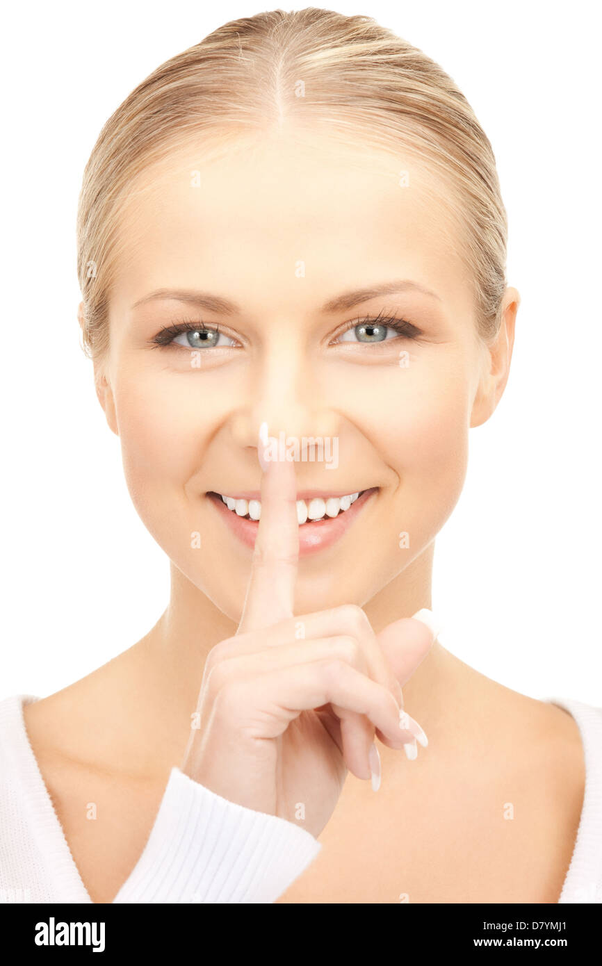 woman with finger on her lips Stock Photo - Alamy
