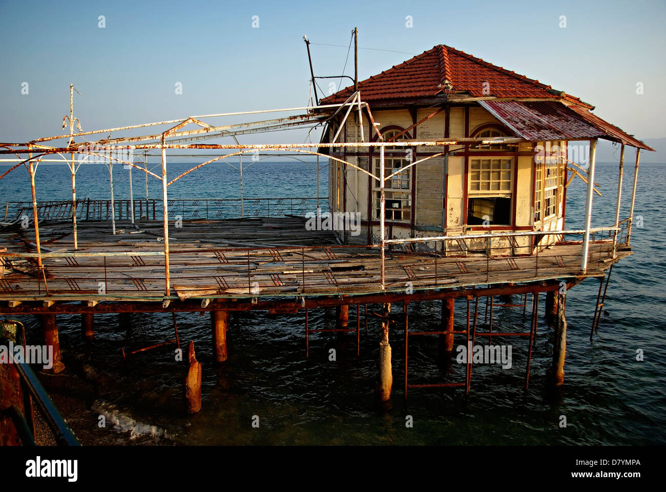 Old abandoned and rusty pier at the sunset Stock Photo - Alamy