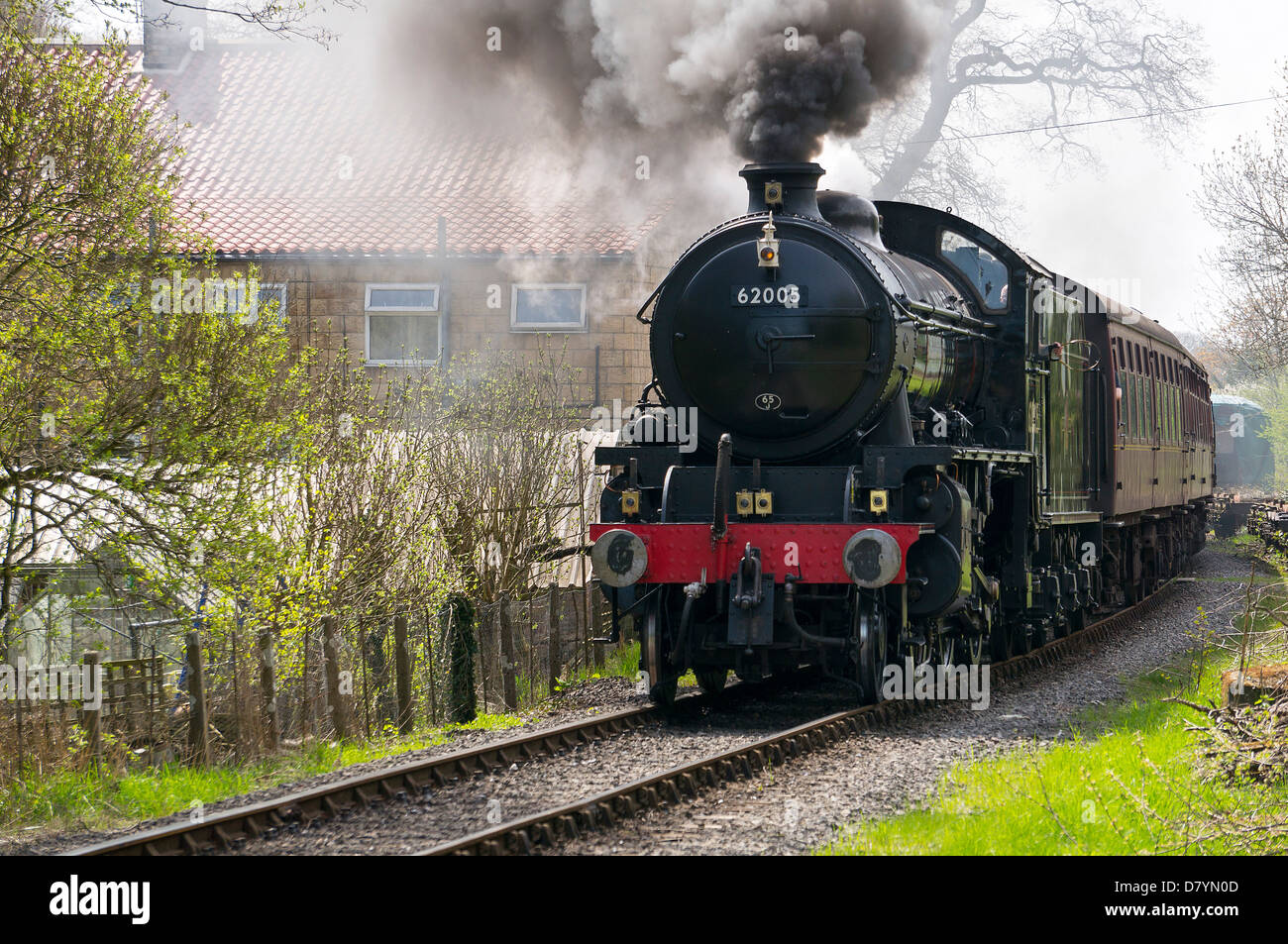Steam Train departing with passenger service on heritage line Stock ...