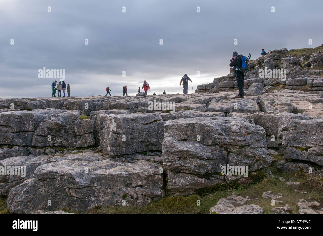 People standing & walking on upland limestone pavement, spectacular ...