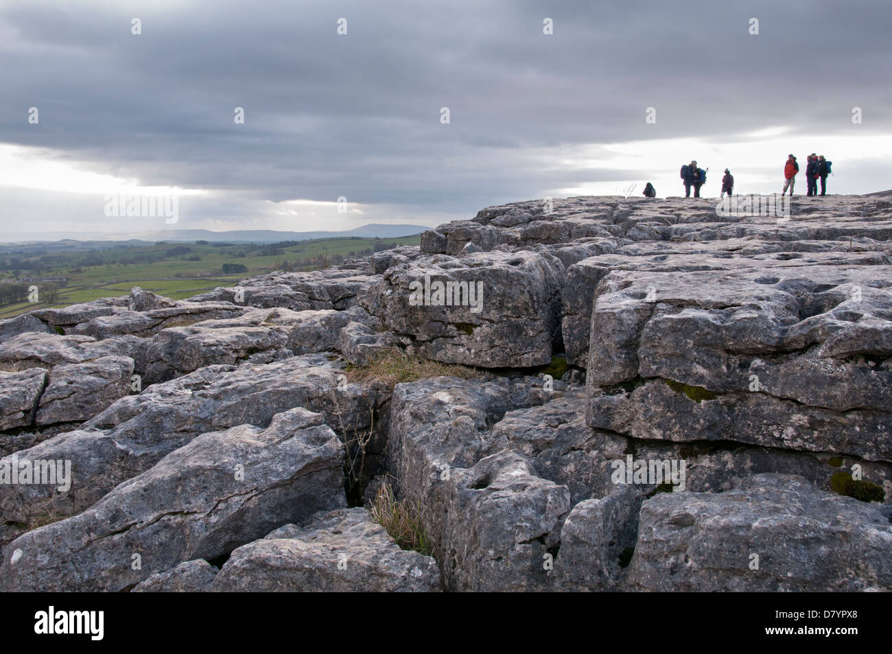 People standing & walking on upland limestone pavement, spectacular ...