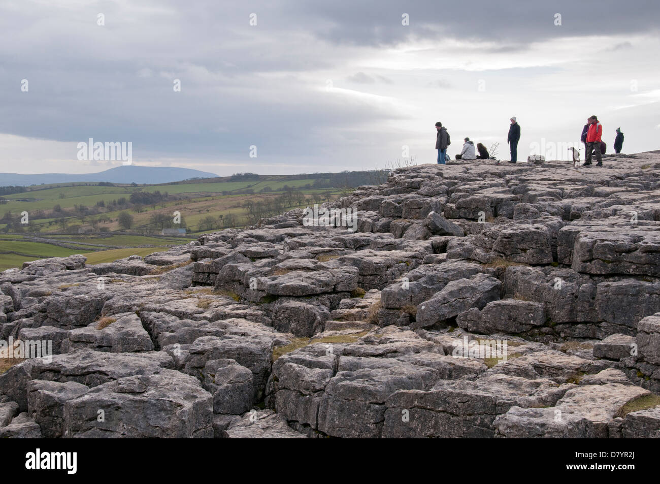 People standing & walking on upland limestone pavement, spectacular ...