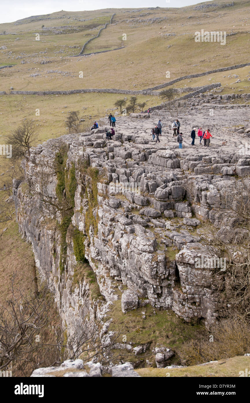 People standing & walking on upland limestone pavement, spectacular ...