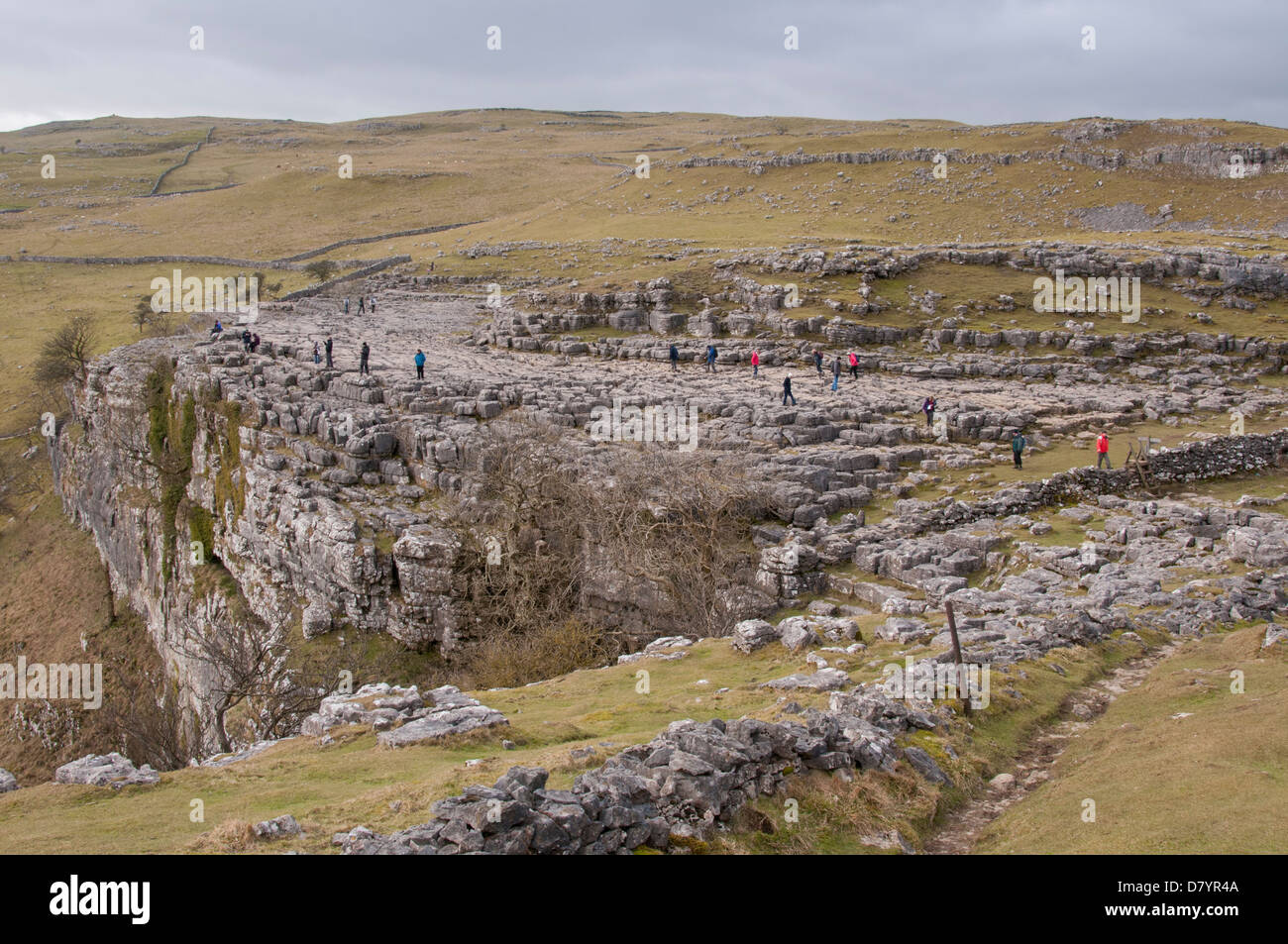 People standing & walking on upland limestone pavement, spectacular ...