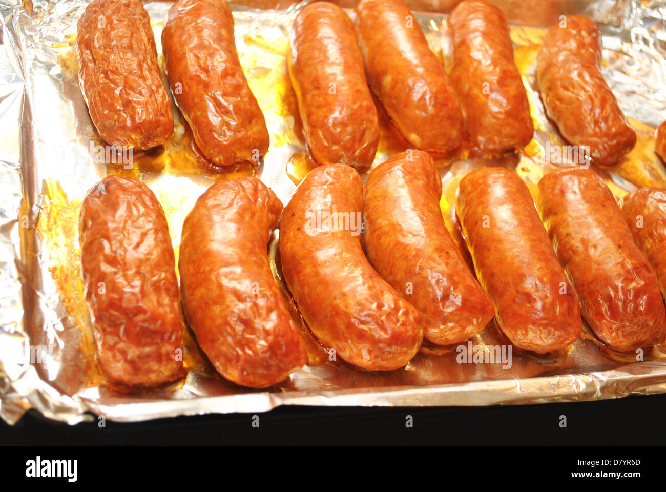 Greasy Italian Sausage Baked on Foil Stock Photo - Alamy