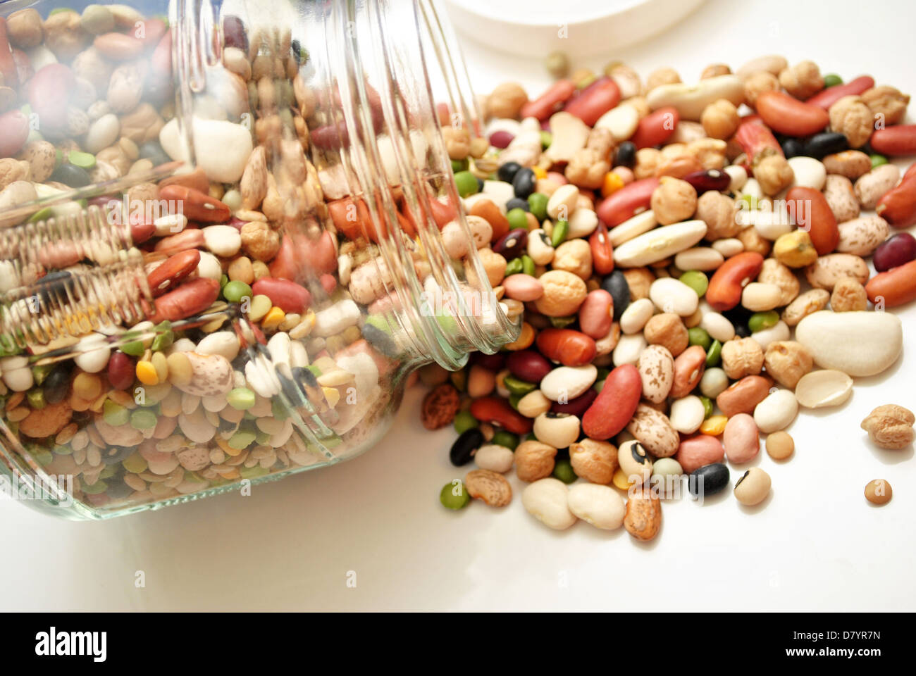 Mixed Dry Beans Spilling out of a Glass Jar Stock Photo - Alamy