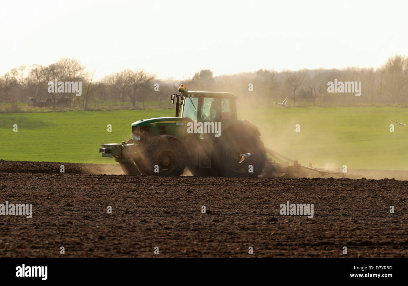 Tractor in dusty field hi-res stock photography and images - Alamy