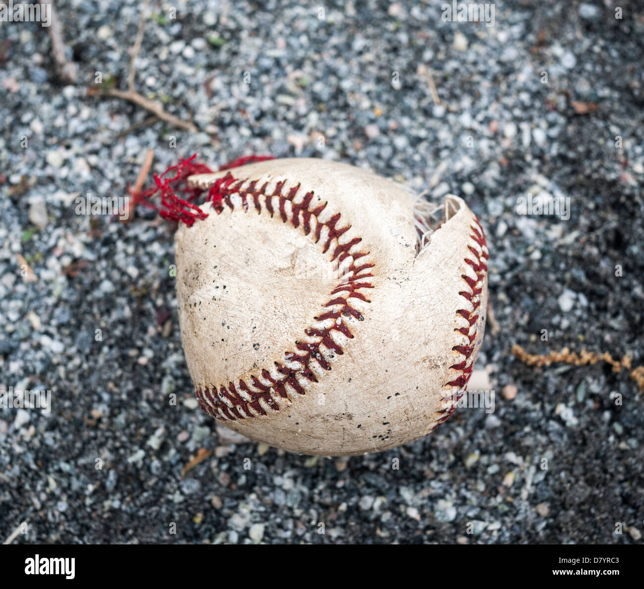 A damaged softball is seen after a game in new York on Saturday, May 11 ...