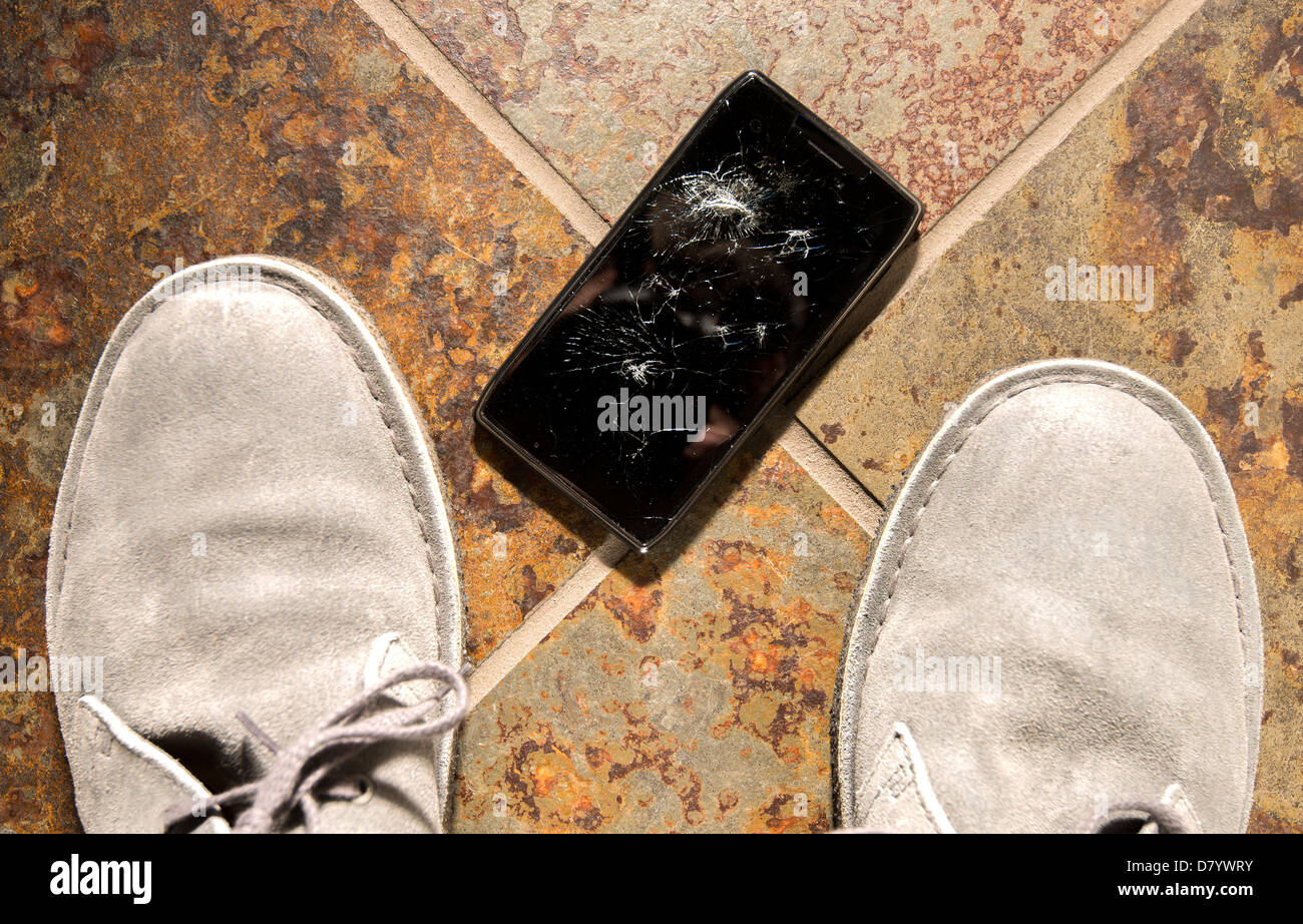 Smart phone with a cracked screen hi-res stock photography and images ...