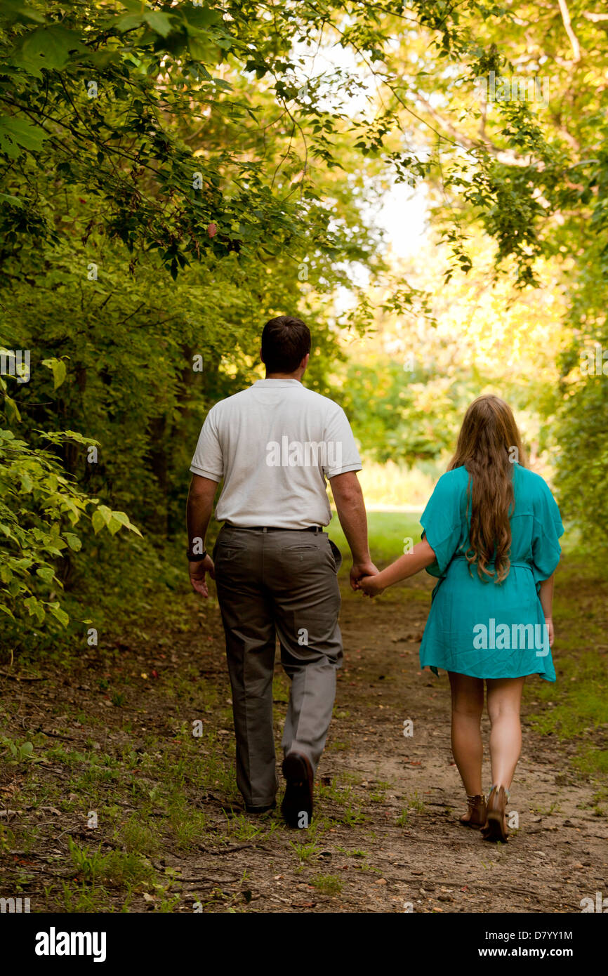 Man and woman walking on path Stock Photo - Alamy