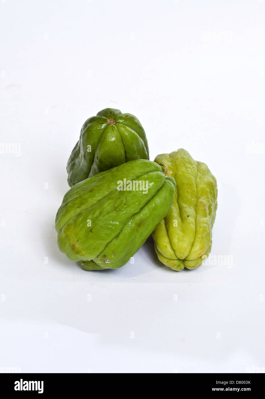 Three whole green chokoes against a white background Stock Photo - Alamy