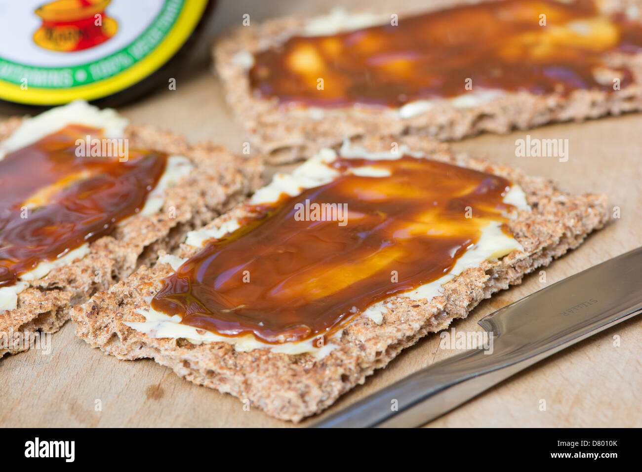 Ryvita rye crispbread with butter and Marmite yeast extract. UK, 2013 ...