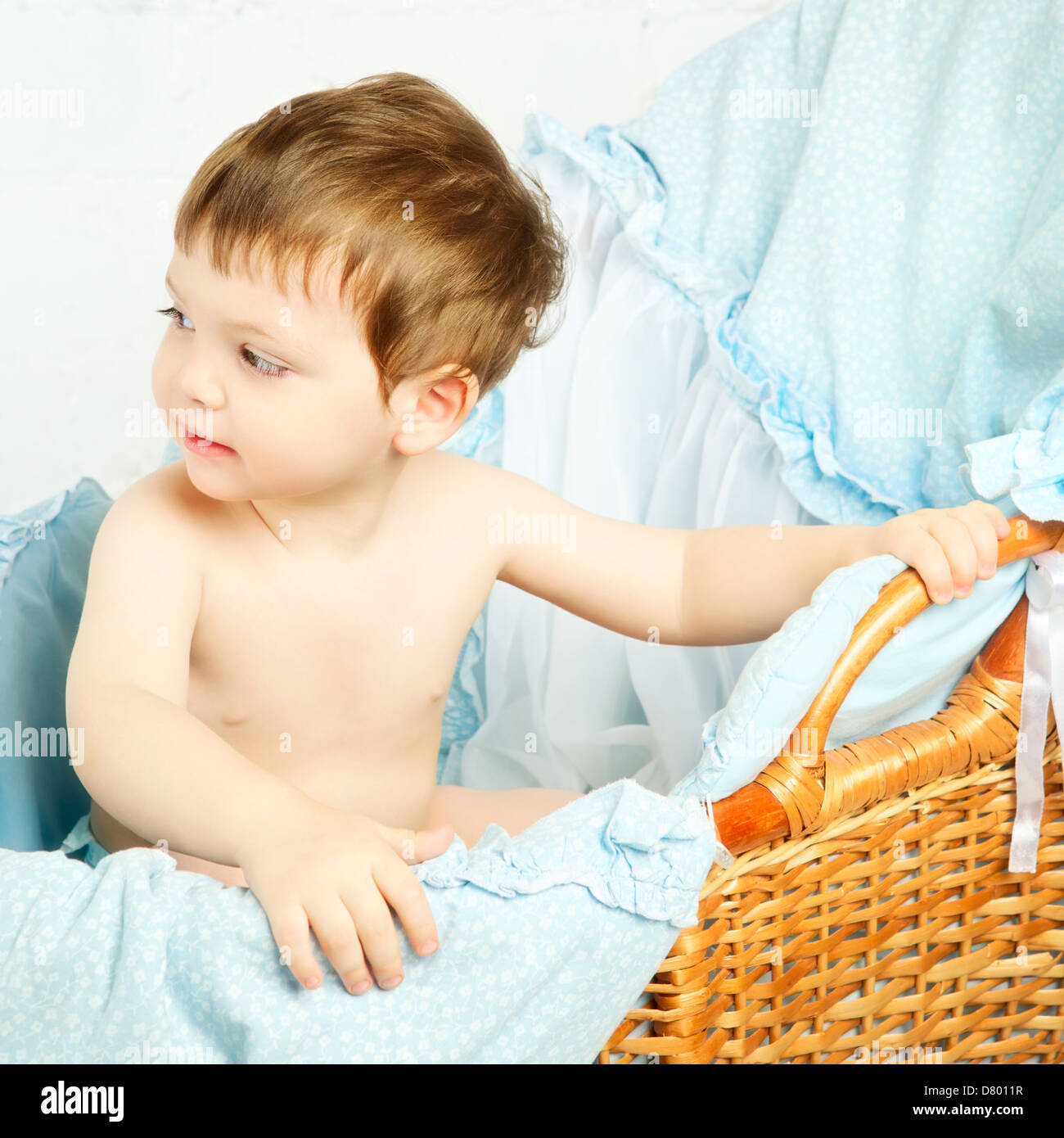 funny boy in cradle, happy and smiling Stock Photo - Alamy