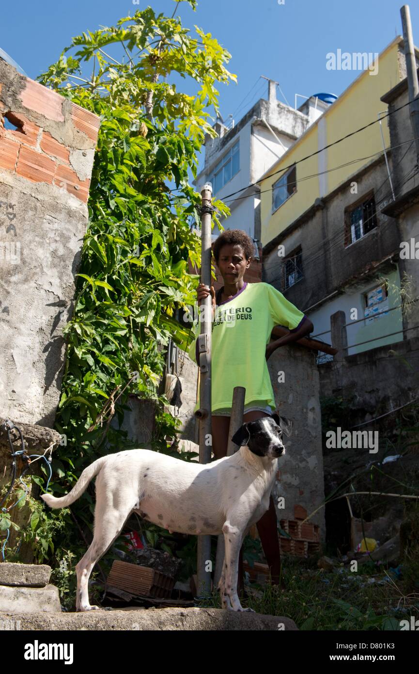 A child stands behind a dog in the favela Santa Marta in Rio de Janeiro ...