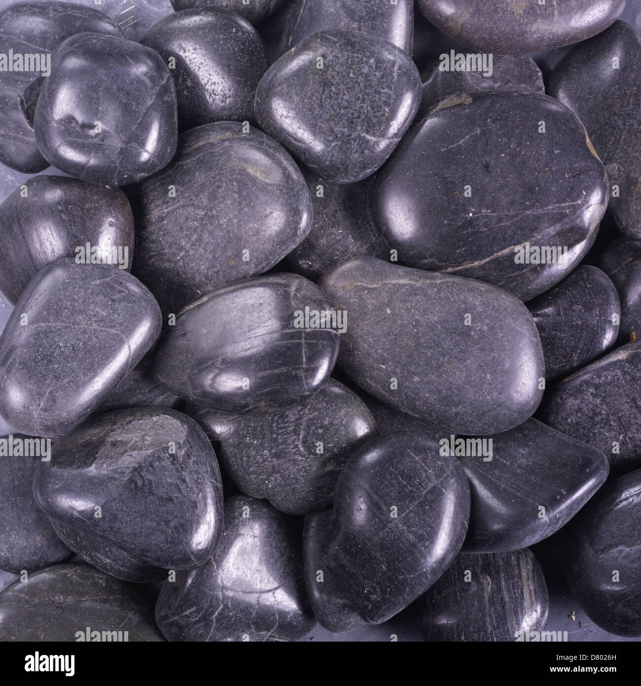 Shiny dark seaside pebbles hi-res stock photography and images - Alamy