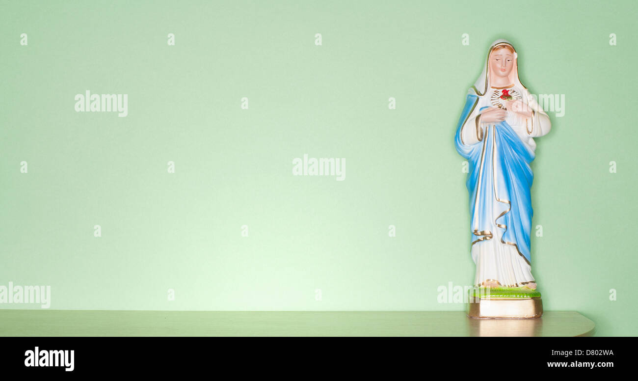 Religious figurine on counter top Stock Photo - Alamy