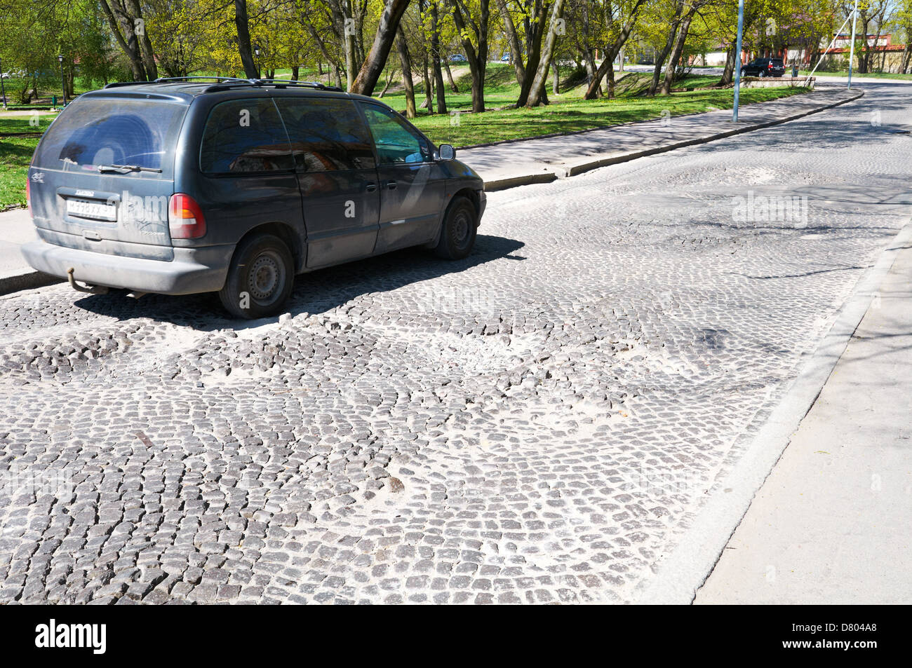 Bad quality of road surface, paving stones Stock Photo - Alamy