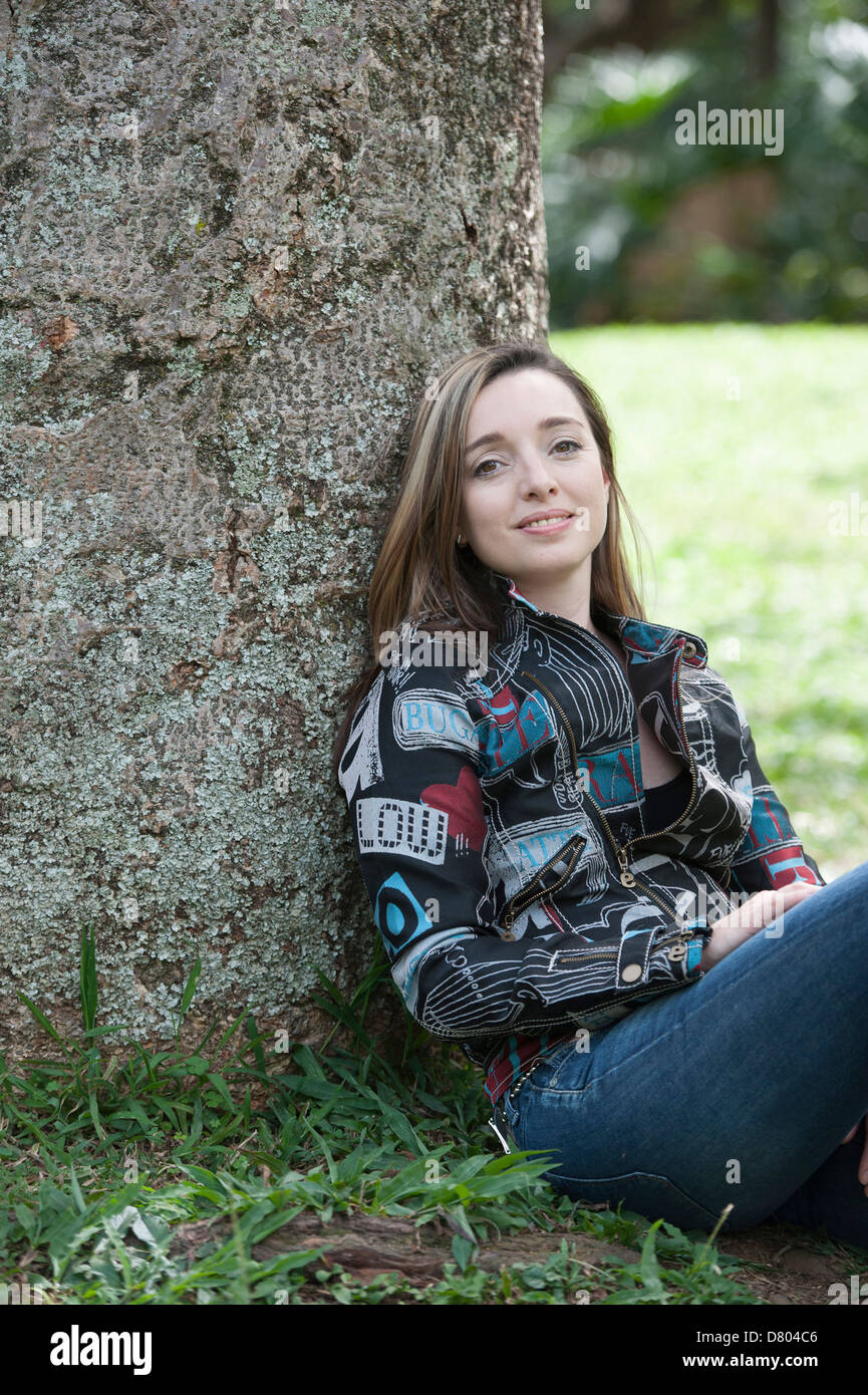Woman leaning tree hi-res stock photography and images - Alamy
