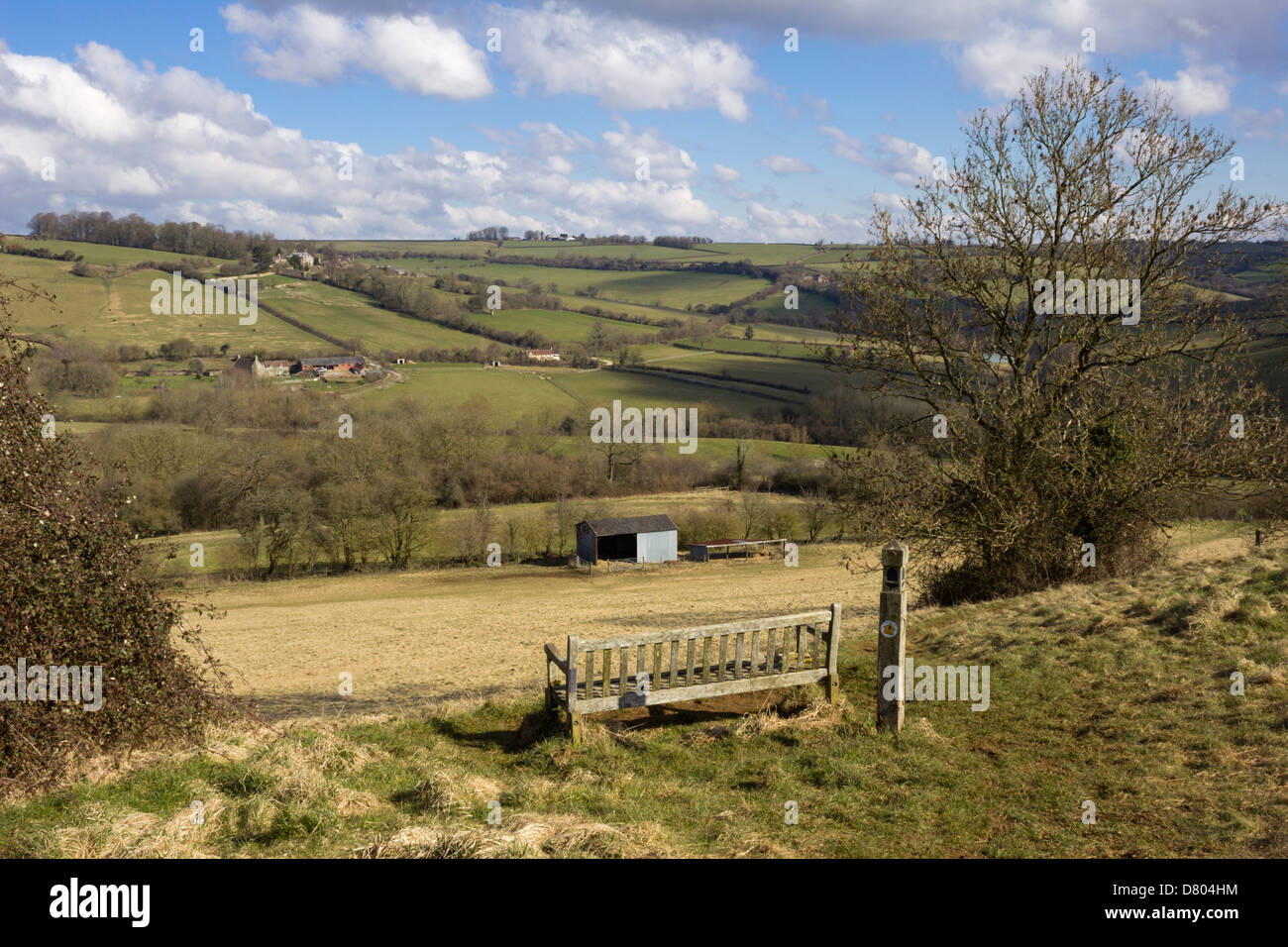 Bench on the Cotswold Way looking to Lilliput Farm, near Cold Ashton ...