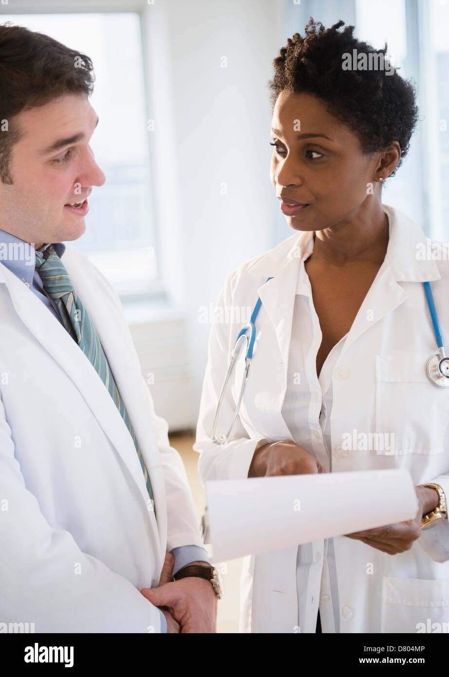 Doctors talking in office Stock Photo - Alamy