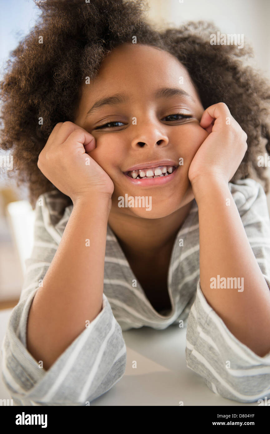 African American girl leaning on elbows Stock Photo - Alamy