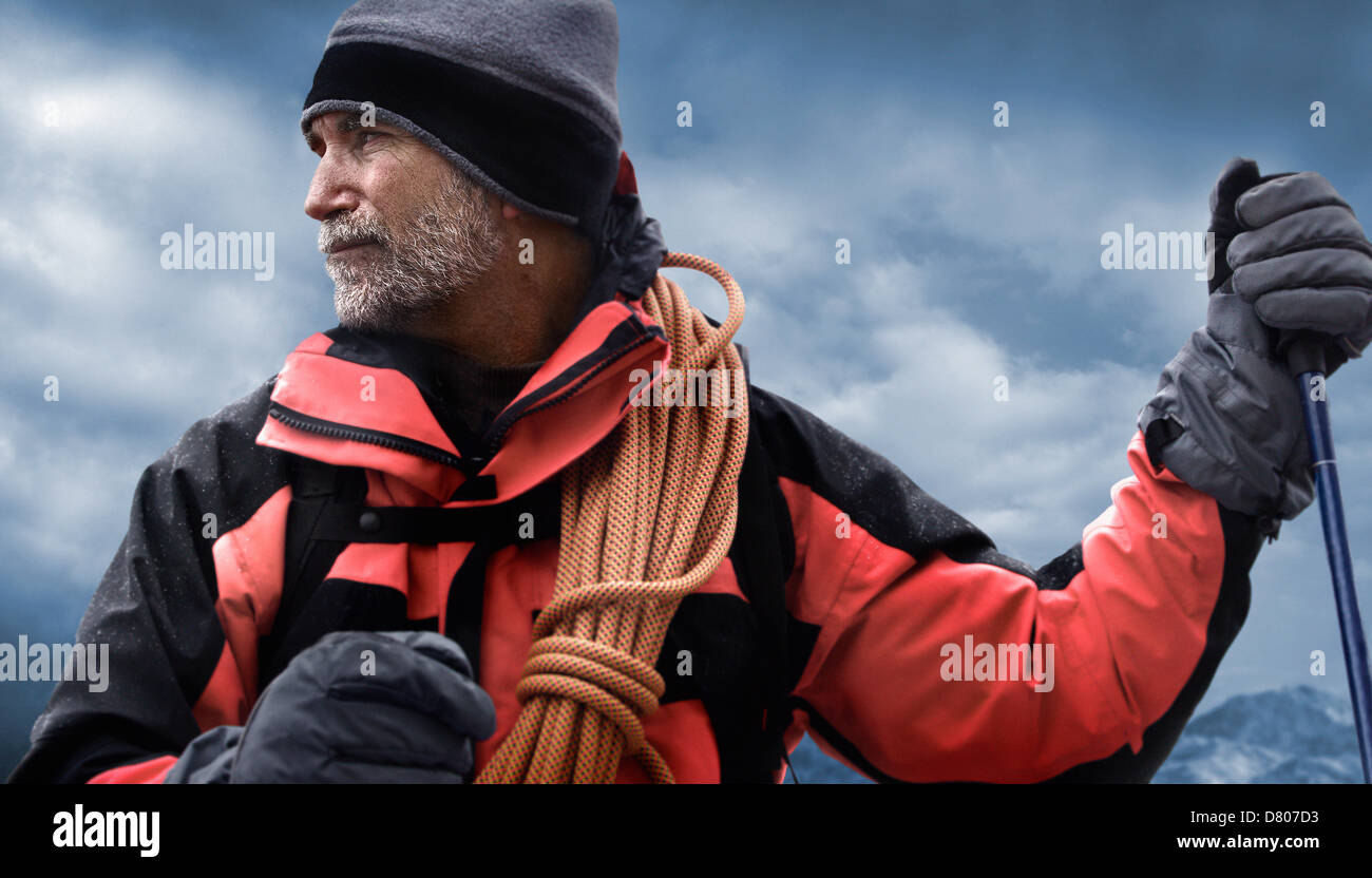 Caucasian rock climber carrying rope Stock Photo - Alamy