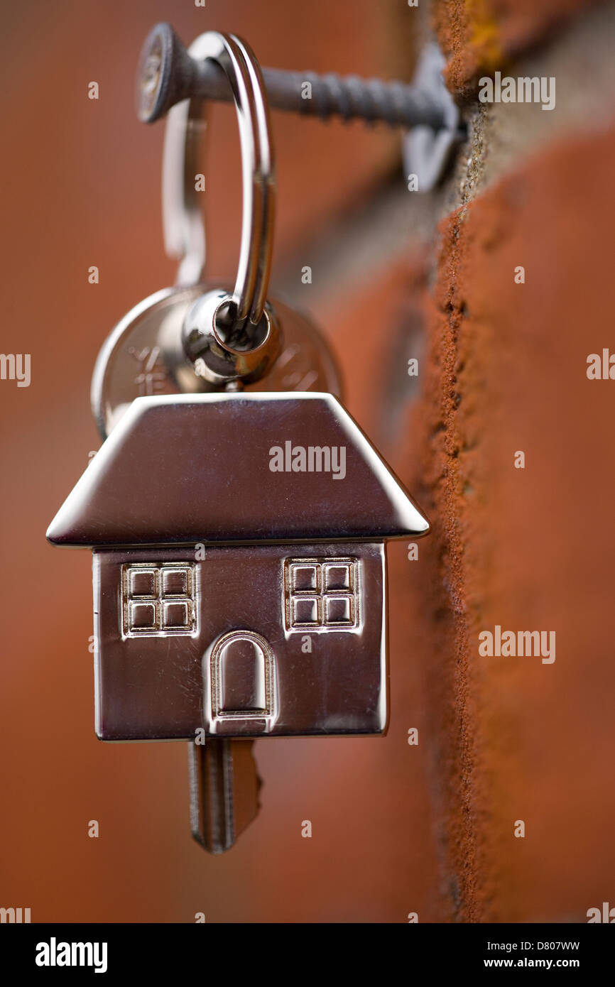 house keys hanging by a brick wall Stock Photo - Alamy