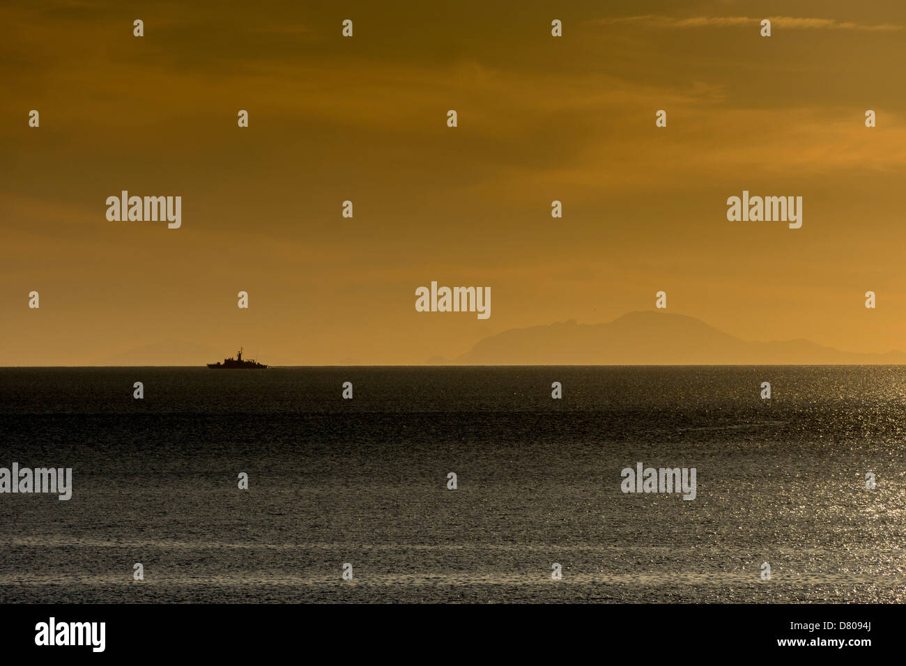 Golden orange sunset with reflections boat and island hi-res stock ...