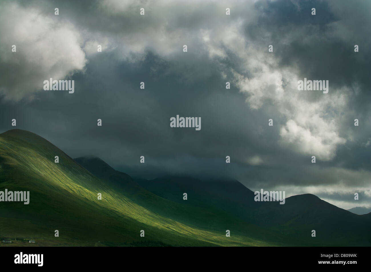 Sun break in clouds in rural landscape Stock Photo - Alamy