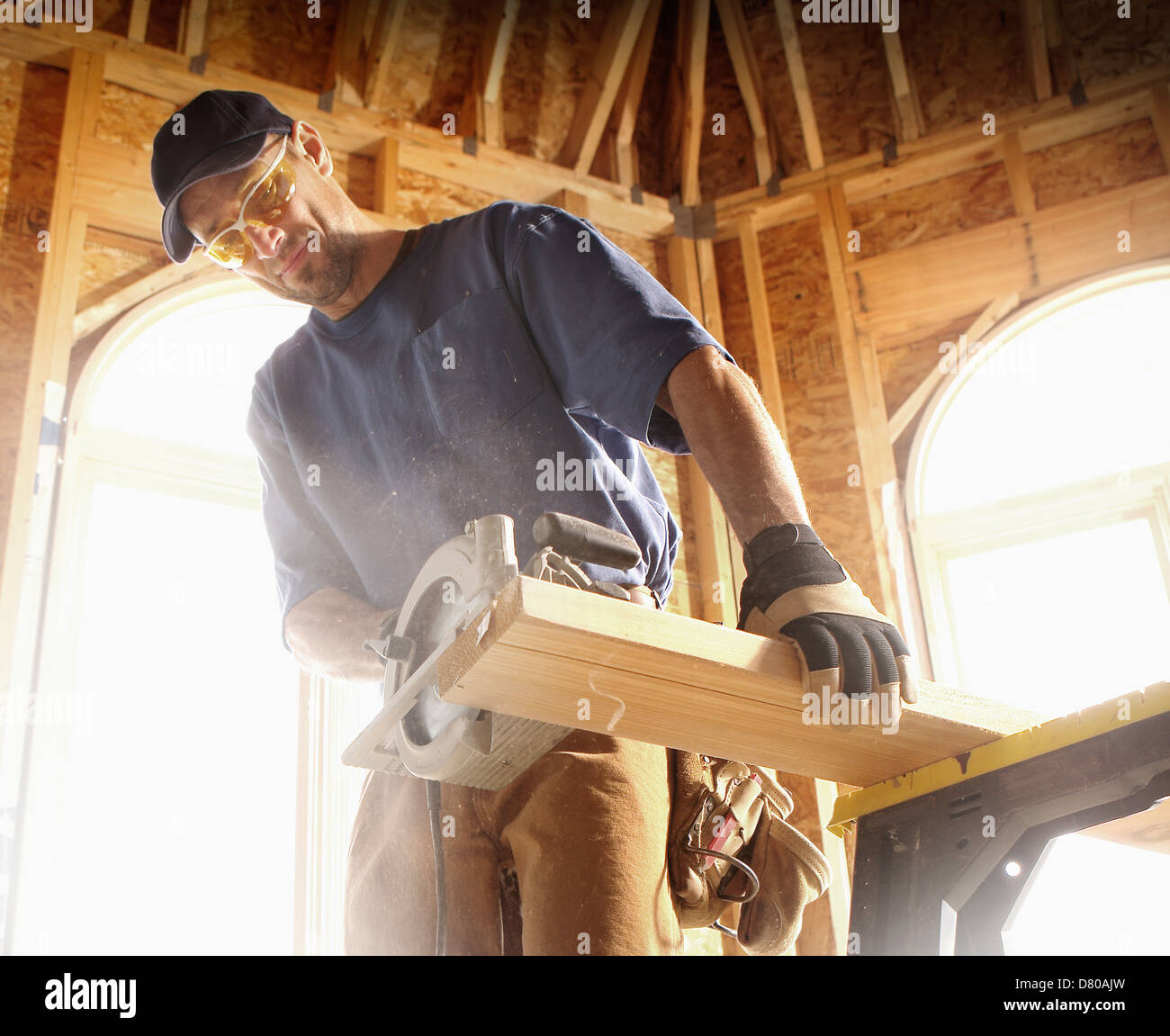 Caucasian carpenter working on building Stock Photo - Alamy