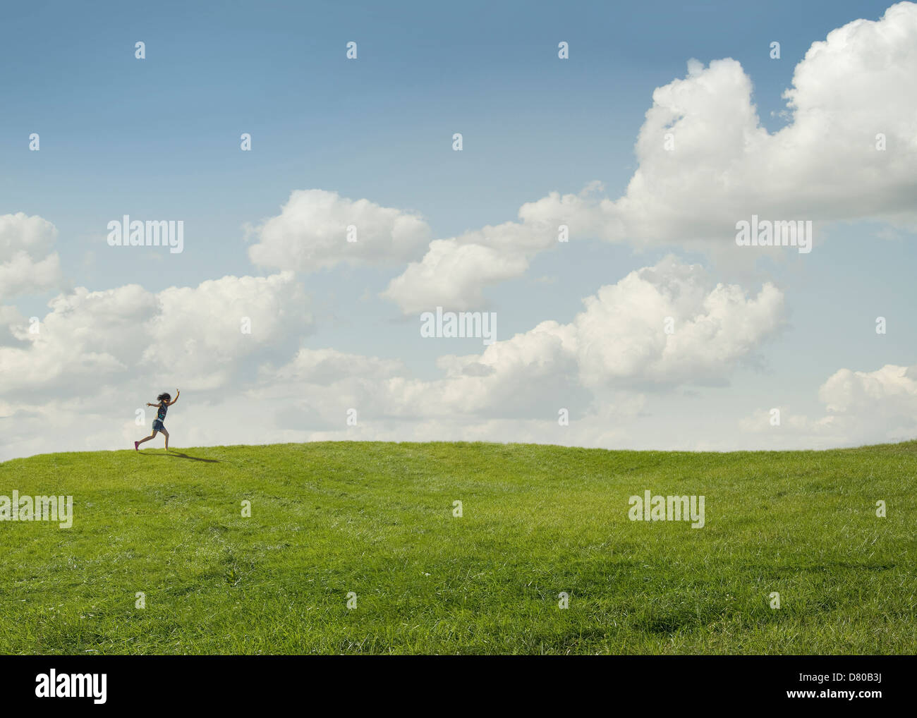 Girl running in rural landscape Stock Photo - Alamy