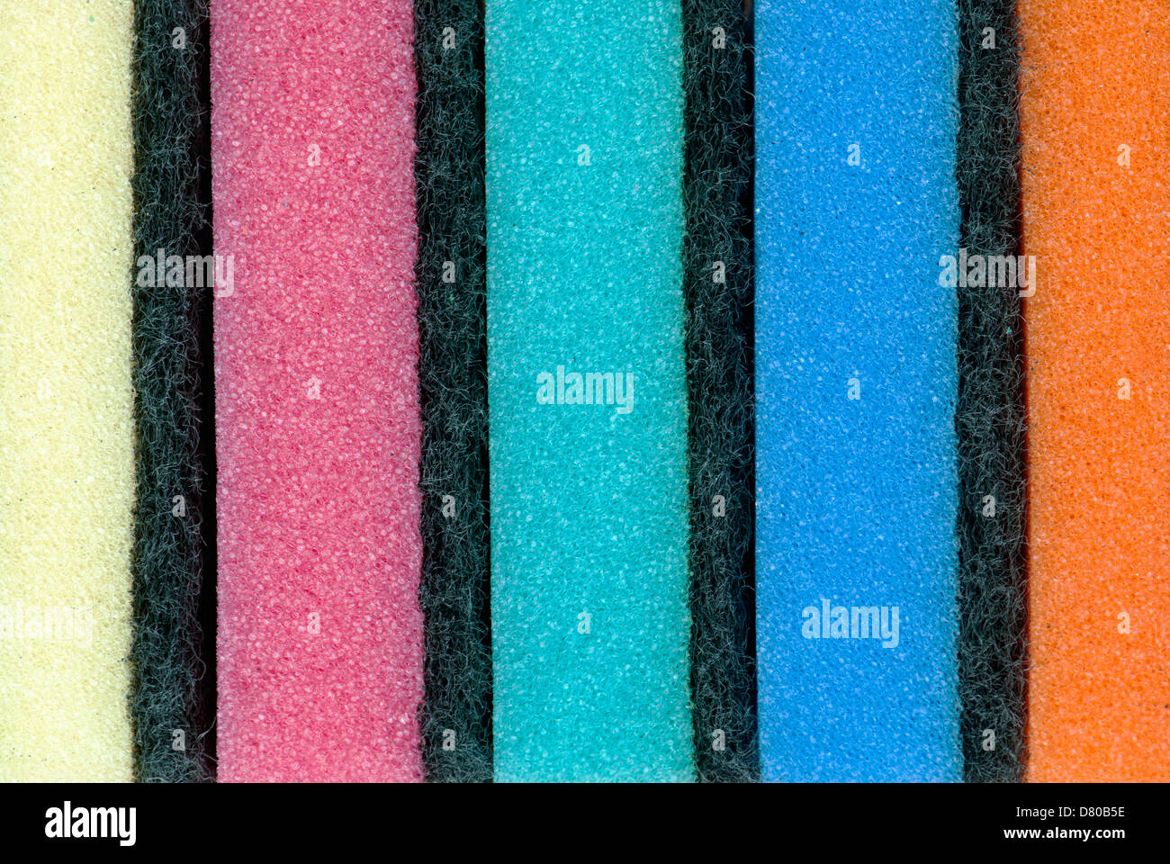 Multi coloured kitchen sponges for ware washing Stock Photo - Alamy