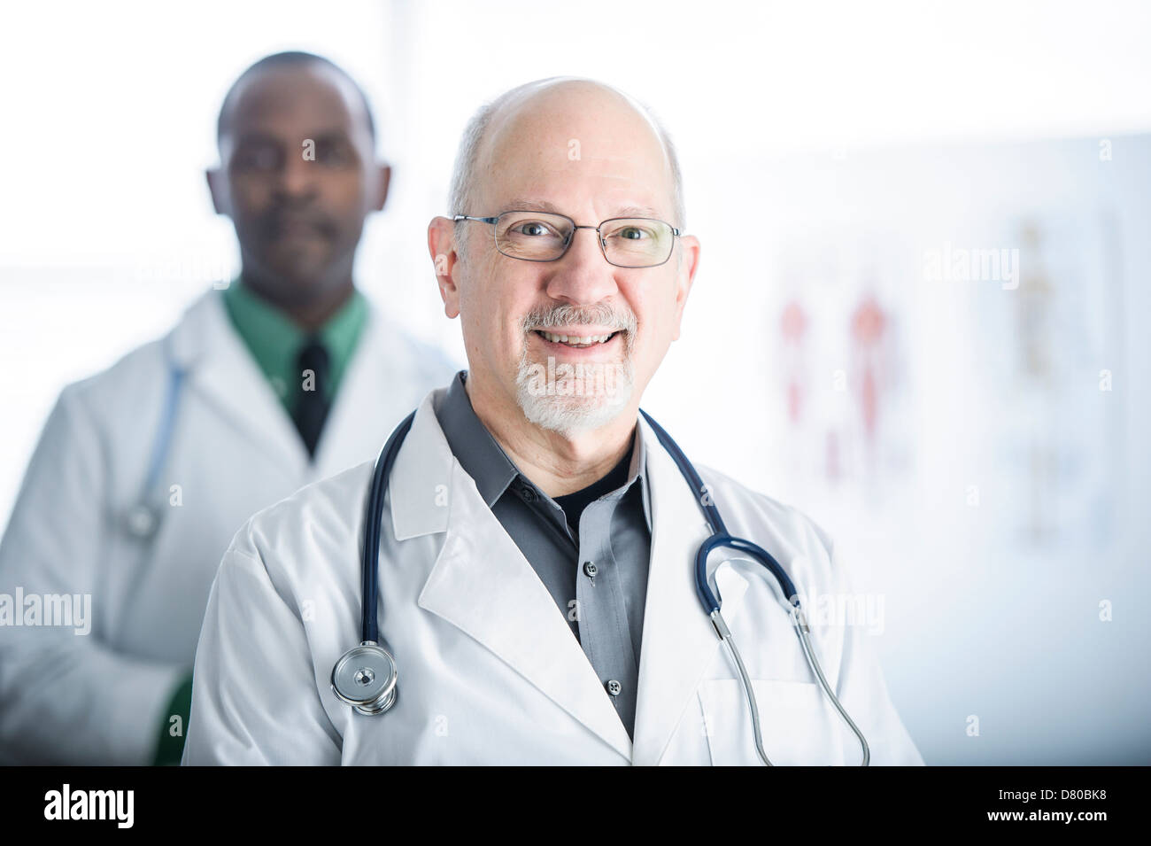 Doctors smiling in office Stock Photo - Alamy