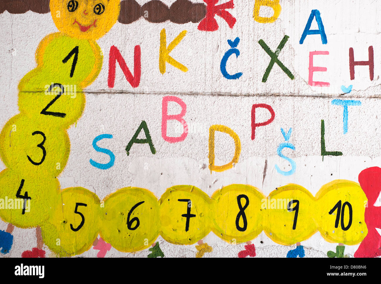Funny letters and numbers on the wall of the school Stock Photo - Alamy