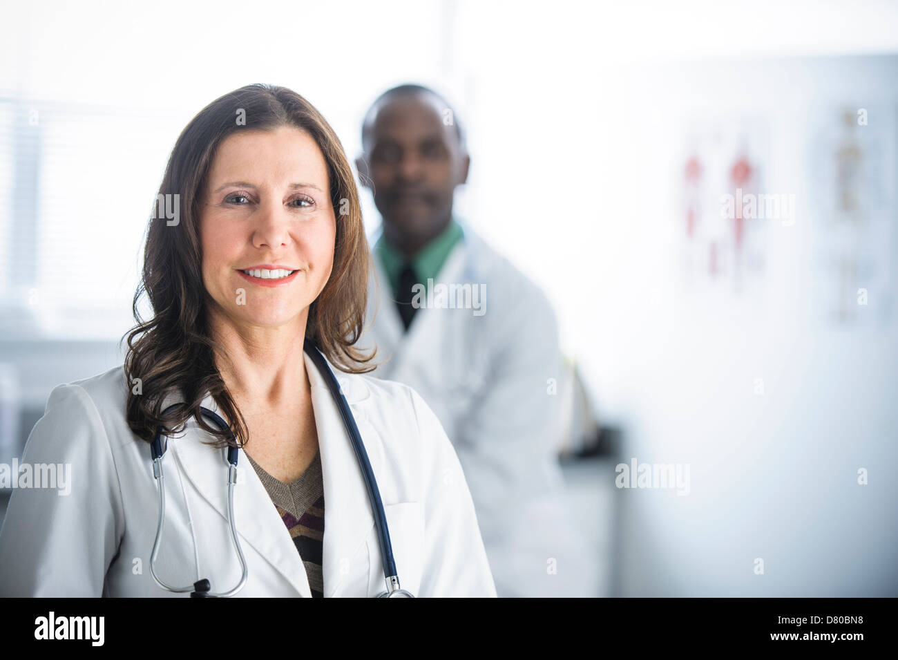 Doctors standing in office Stock Photo - Alamy