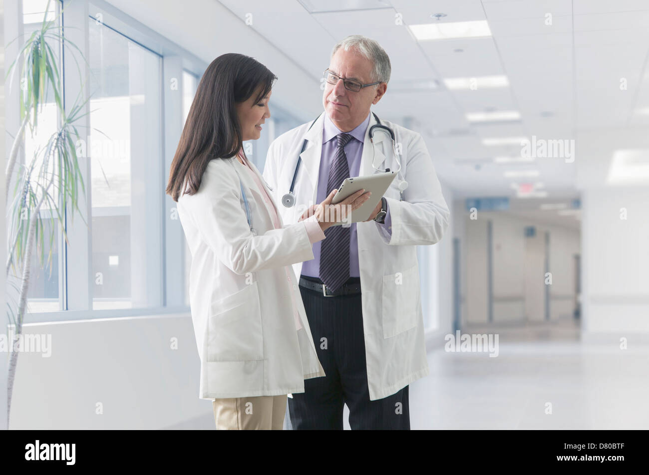 Doctors talking in hospital Stock Photo - Alamy